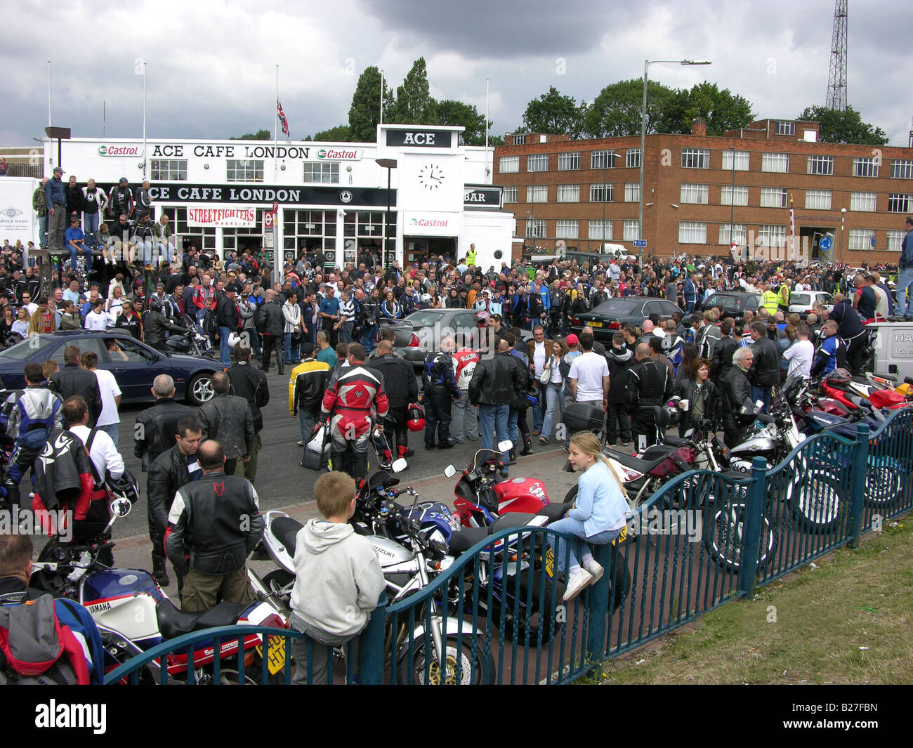 Spectators watching bikers at the Ace Cafe, London, England, Uk Stock ...