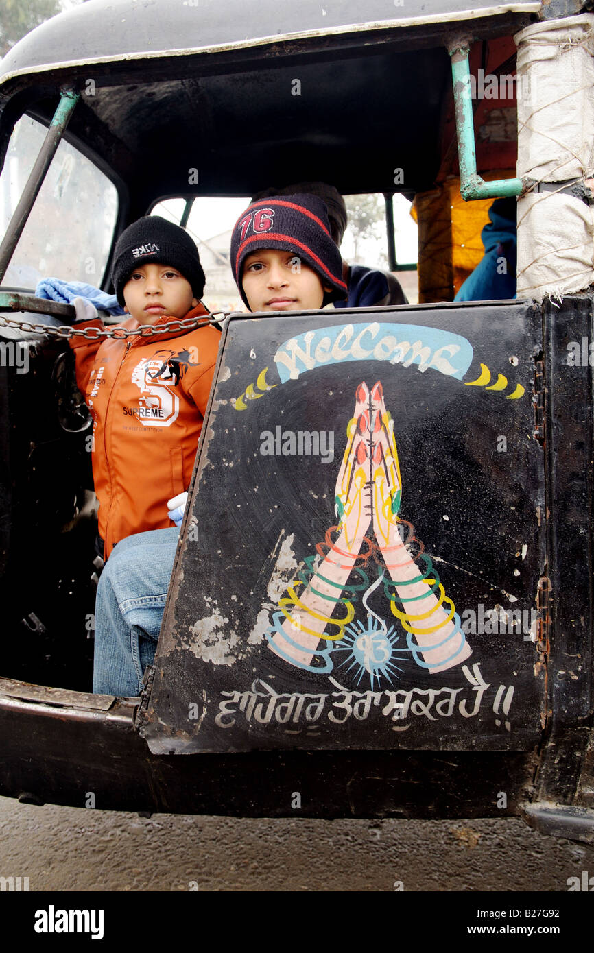 cute kids sit inside a colorful auto rickshaw in Punjab,India Stock ...
