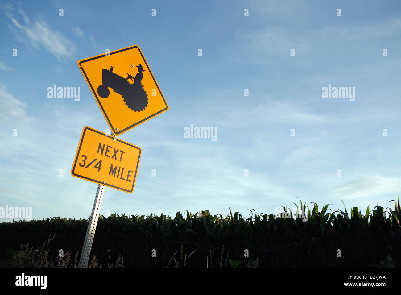 Tractor, road sign, corn field, southern Vermont Stock Photo - Alamy