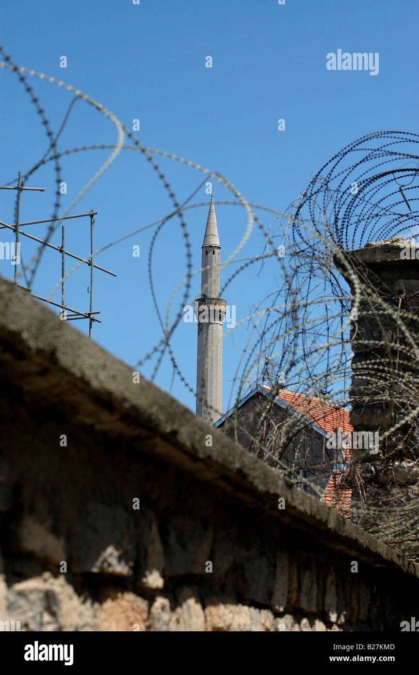 Barb wire and the mosque Stock Photo - Alamy