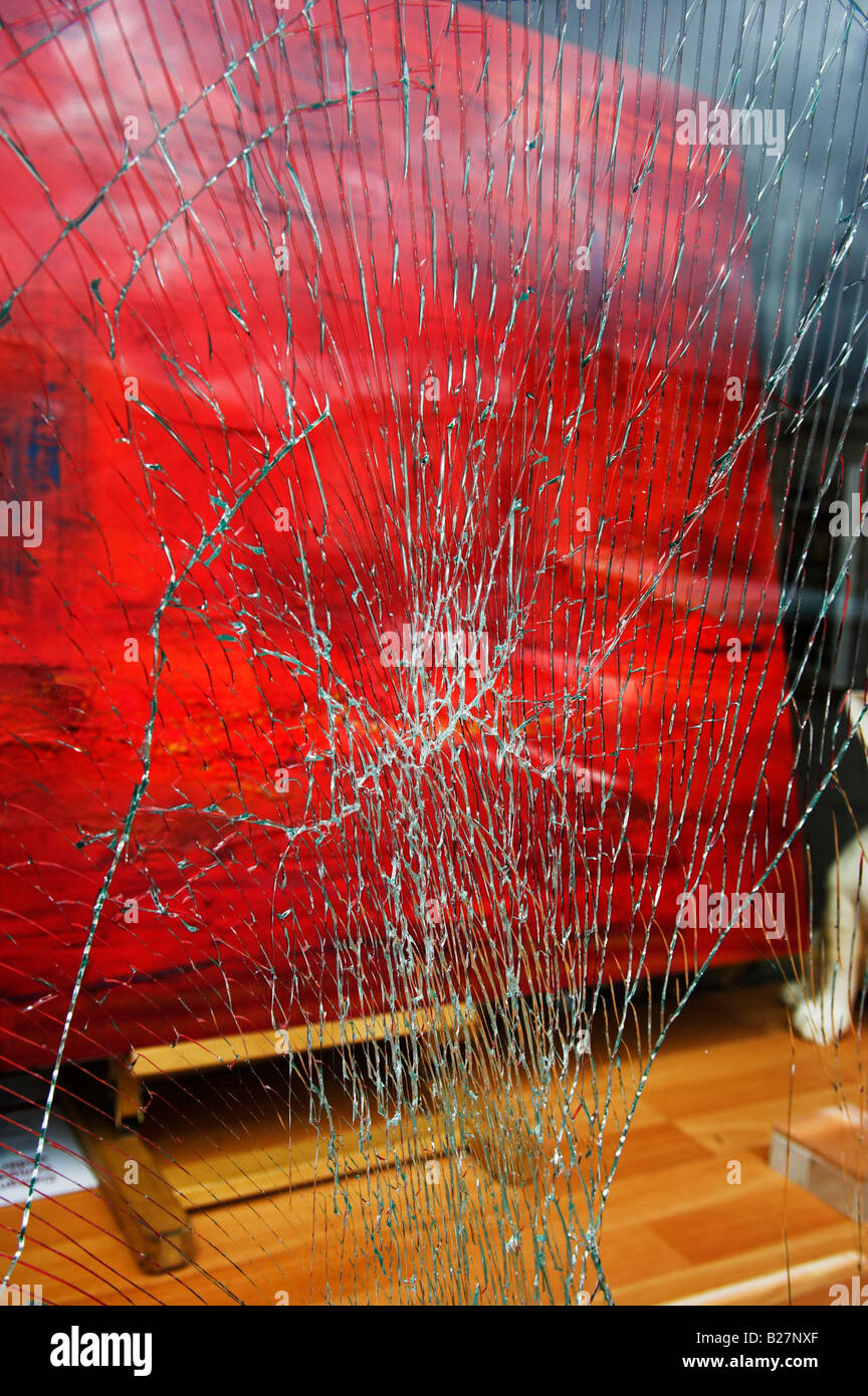 Broken glass in shop window Stock Photo - Alamy