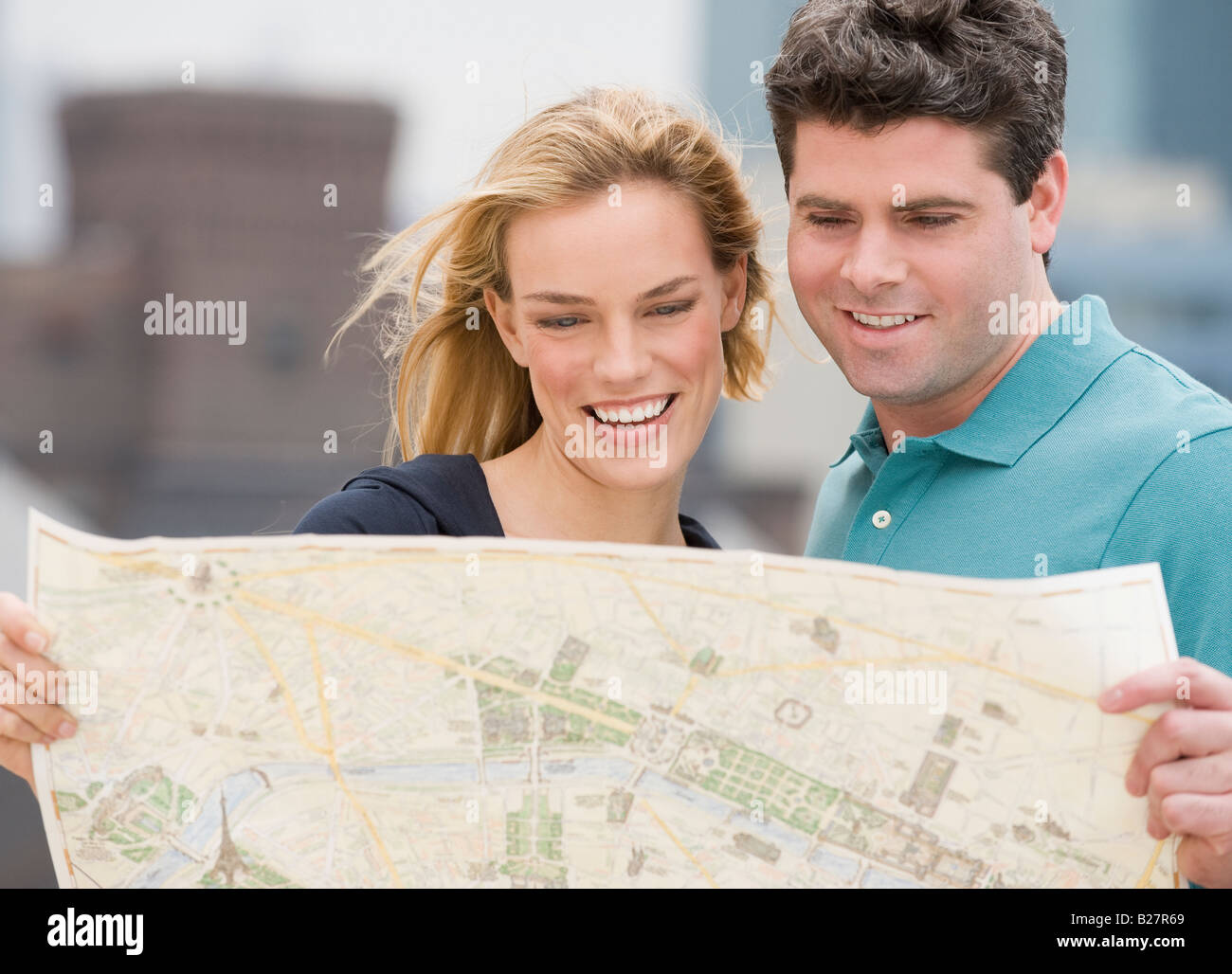Couple looking at map Stock Photo - Alamy