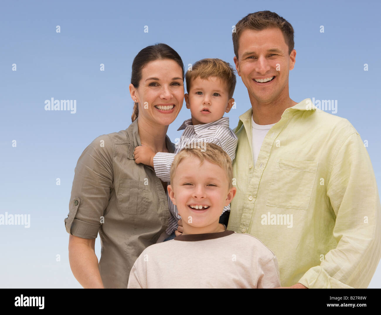 Portrait of family with two children Stock Photo - Alamy