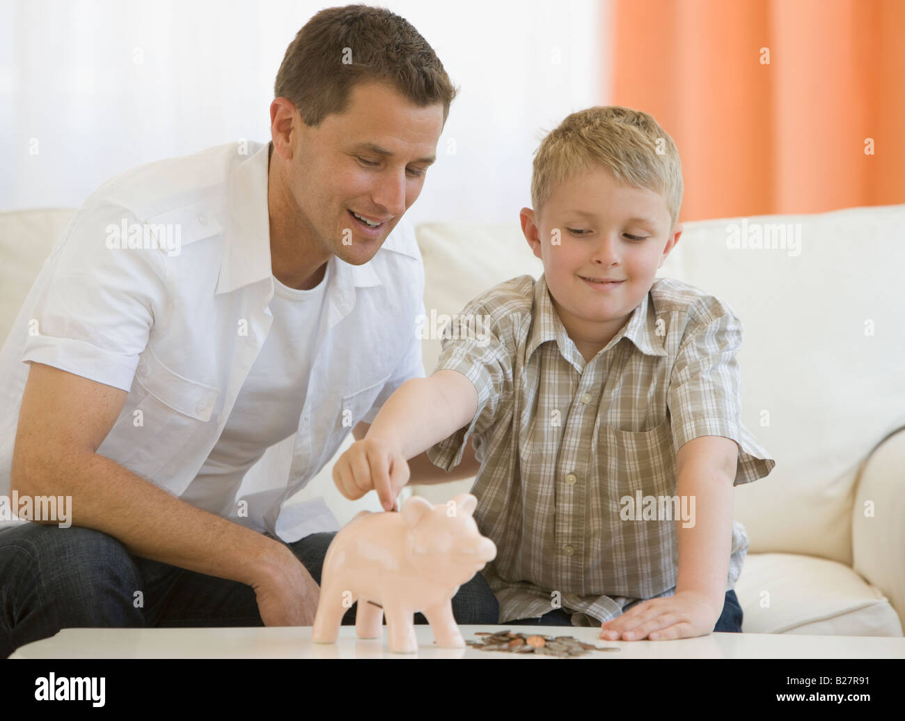 Father son money hi-res stock photography and images - Alamy