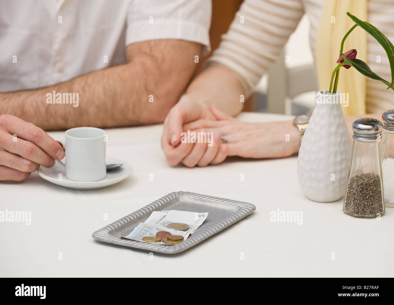 Couple sitting dining table close hi-res stock photography and images ...