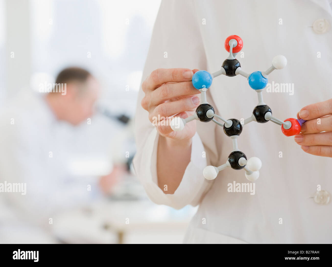 Female scientist holding molecular model Stock Photo - Alamy Female scientist holding molecular model Stock Photo - Alamy