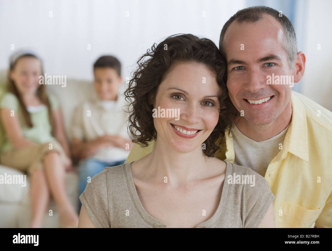 Parents with children in background Stock Photo - Alamy