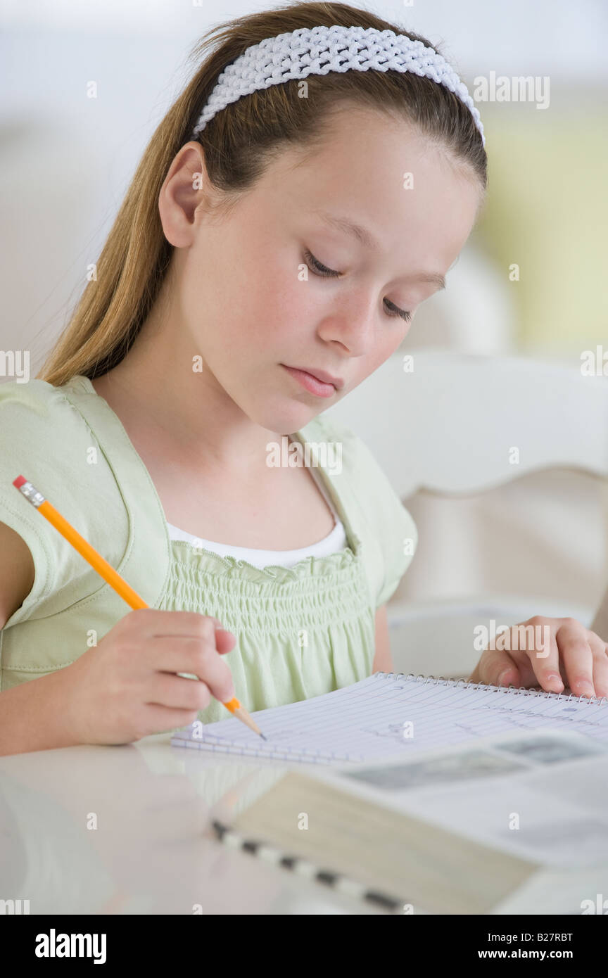 Girl doing homework Stock Photo - Alamy