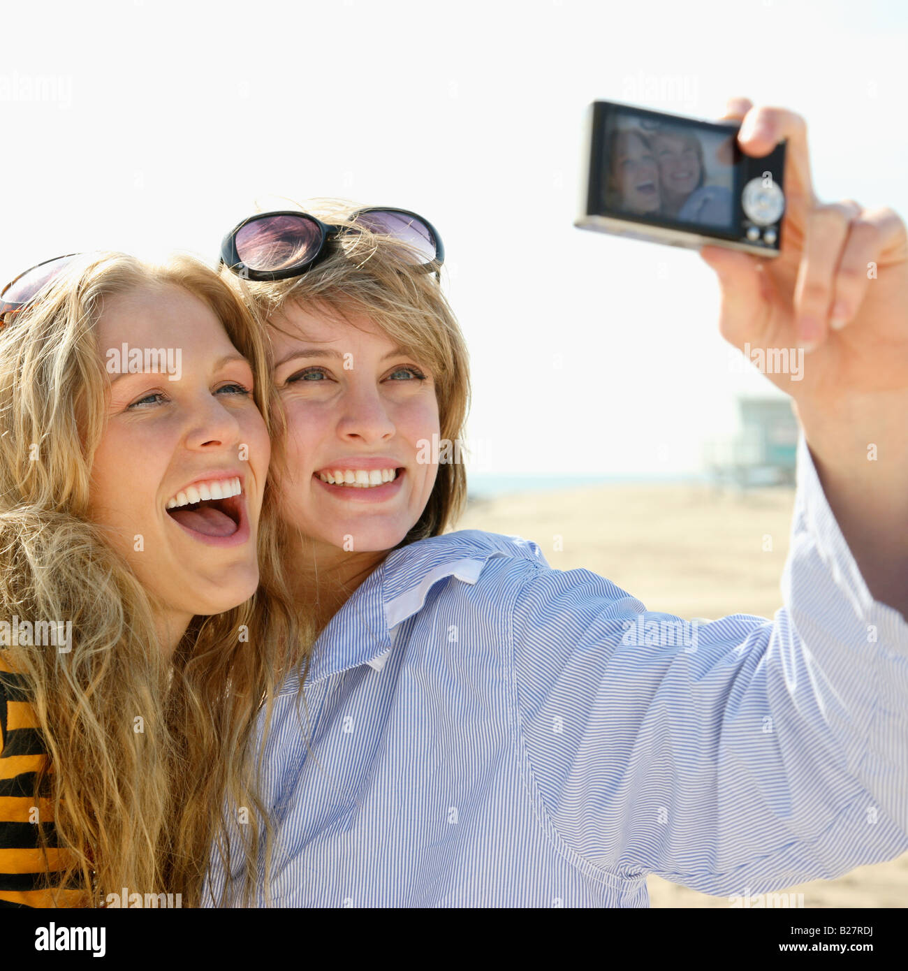 Two young women taking self-portrait Stock Photo - Alamy