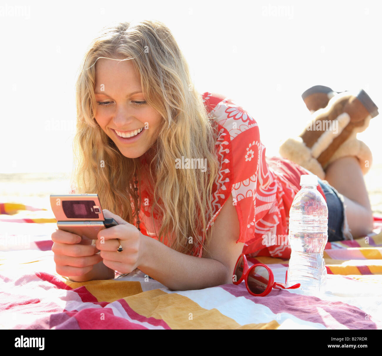 Woman dialing cell phone Stock Photo - Alamy