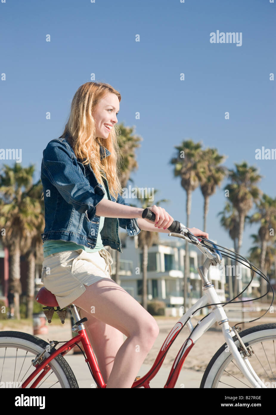 Woman riding bicycle Stock Photo - Alamy
