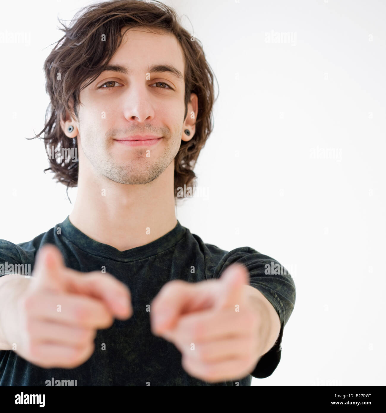 Portrait of man pointing fingers Stock Photo - Alamy