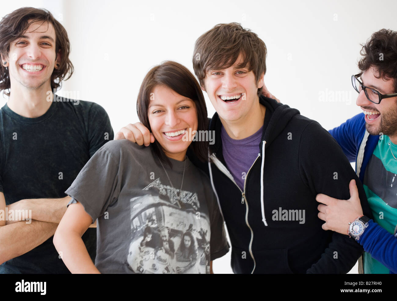 Group of friends laughing Stock Photo - Alamy