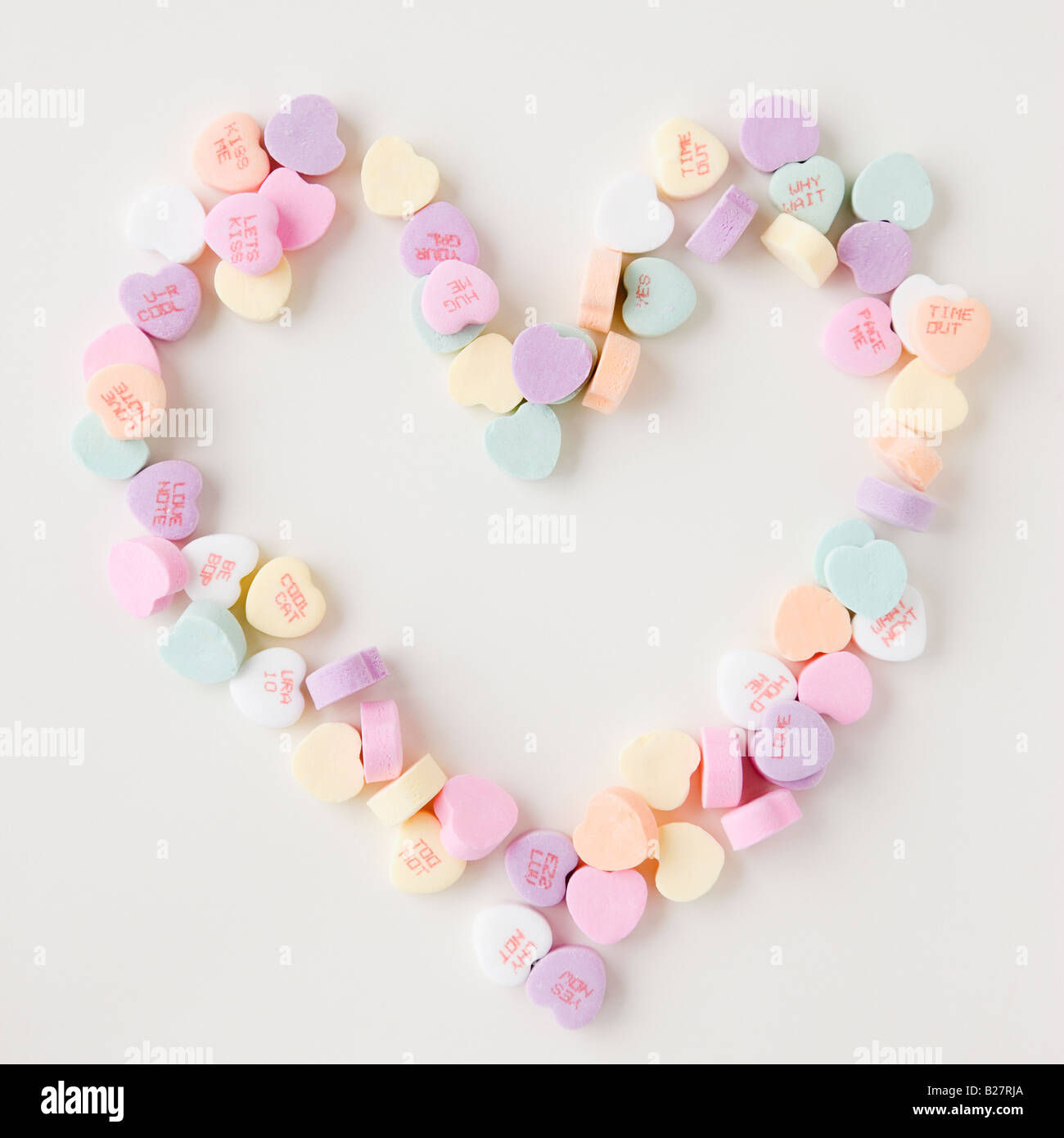 Candy hearts in shape of heart Stock Photo - Alamy