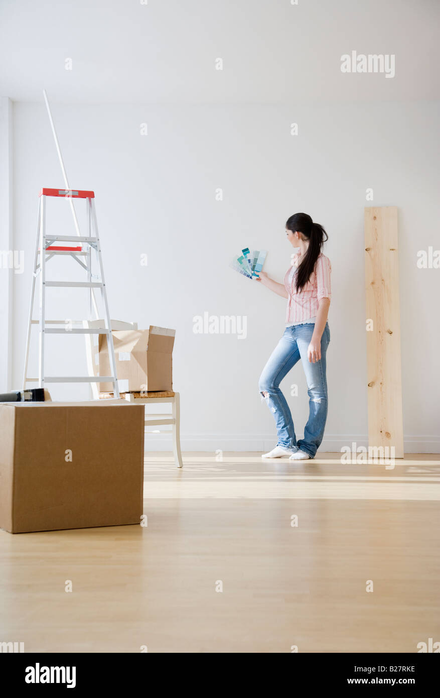 Woman comparing paint color hi-res stock photography and images - Alamy