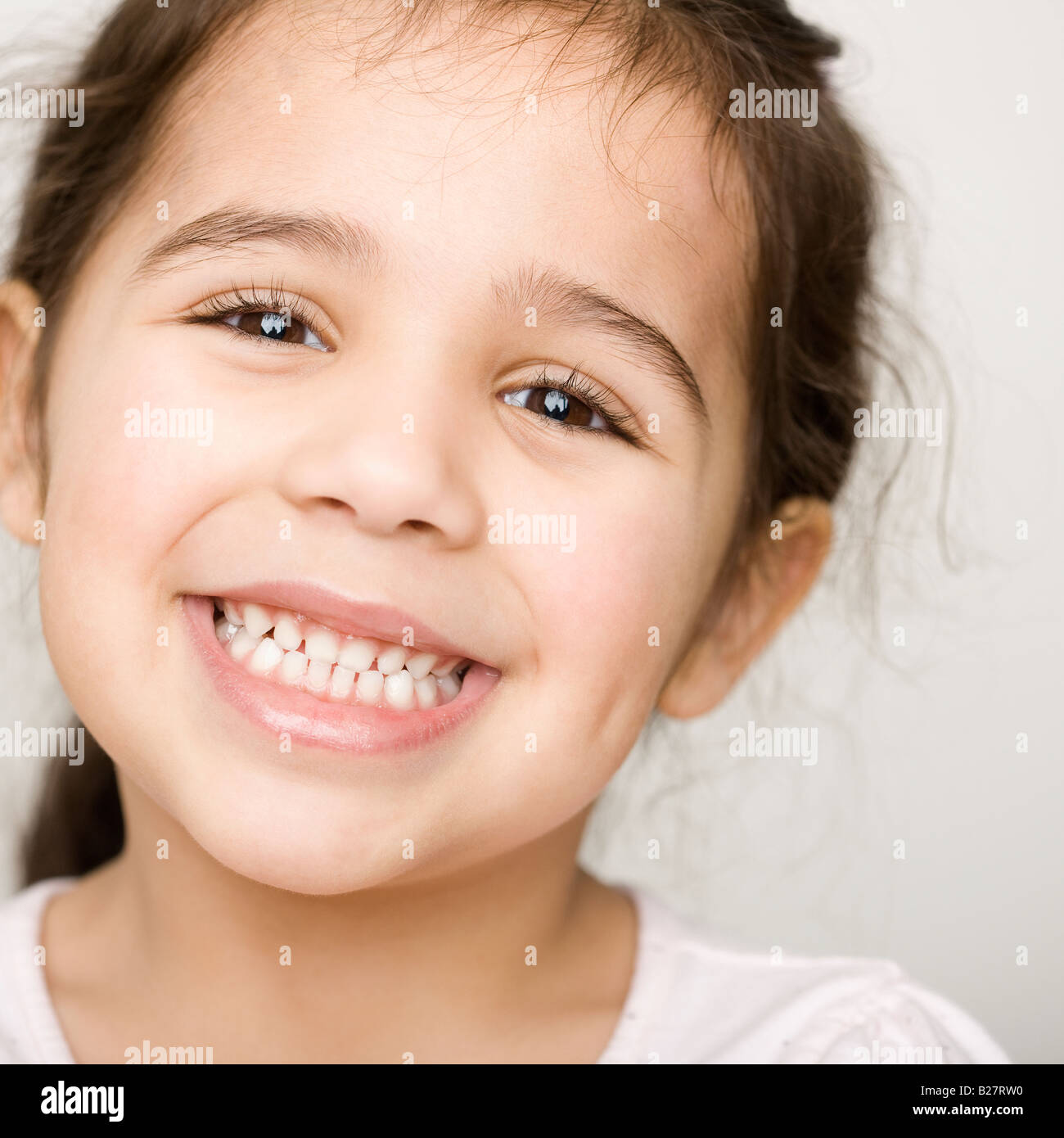 Glad smiling small girl hi-res stock photography and images - Alamy