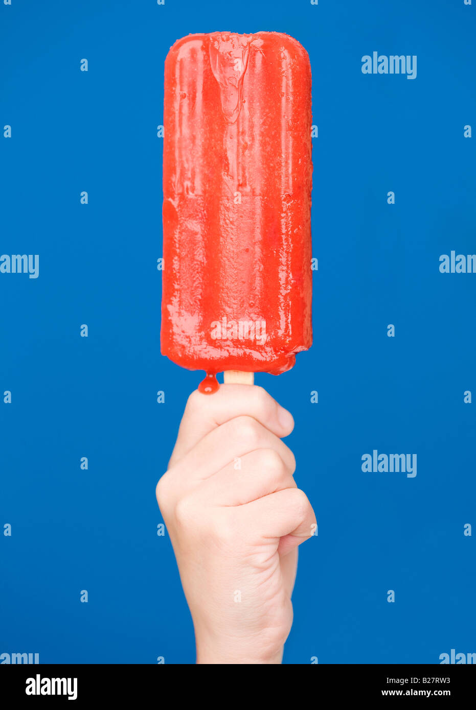 Child holding ice pop Stock Photo - Alamy