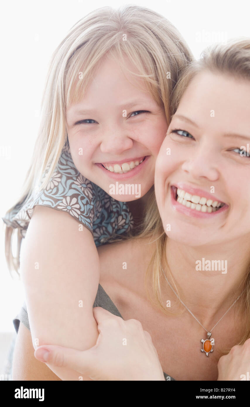 Mother and daughter hugging Stock Photo - Alamy
