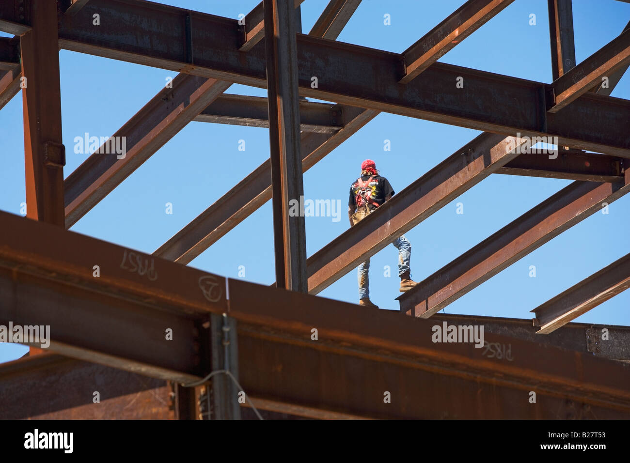 Construction worker on steel beam at construction site Stock Photo - Alamy