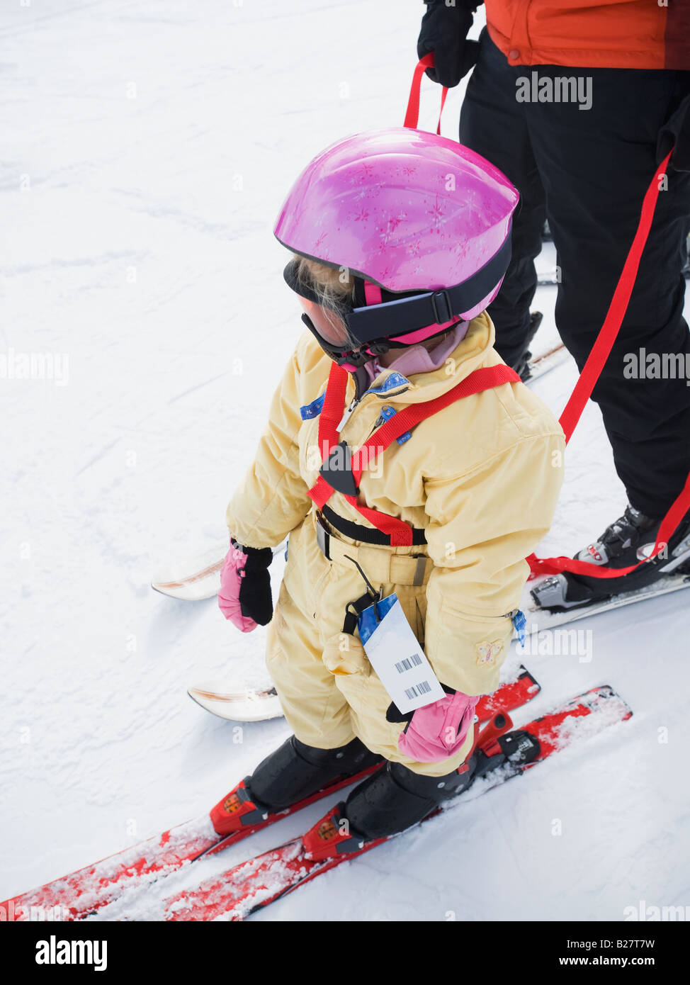 Parent and child skiing Stock Photo - Alamy