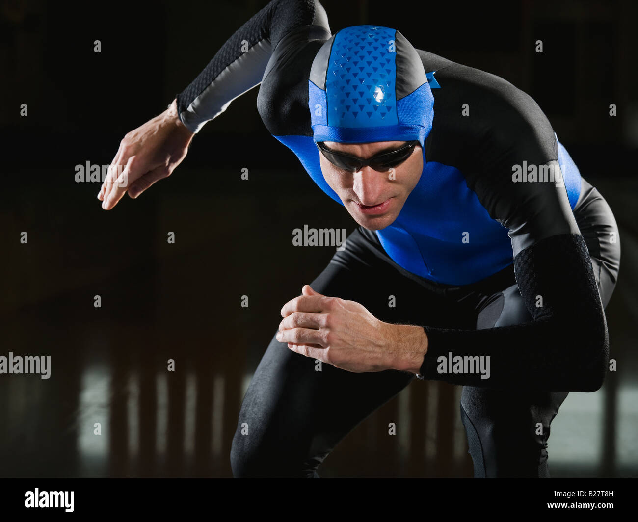 Male speed skater in ready position Stock Photo - Alamy