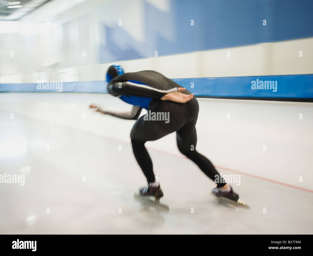 Male speed skater skating Stock Photo - Alamy