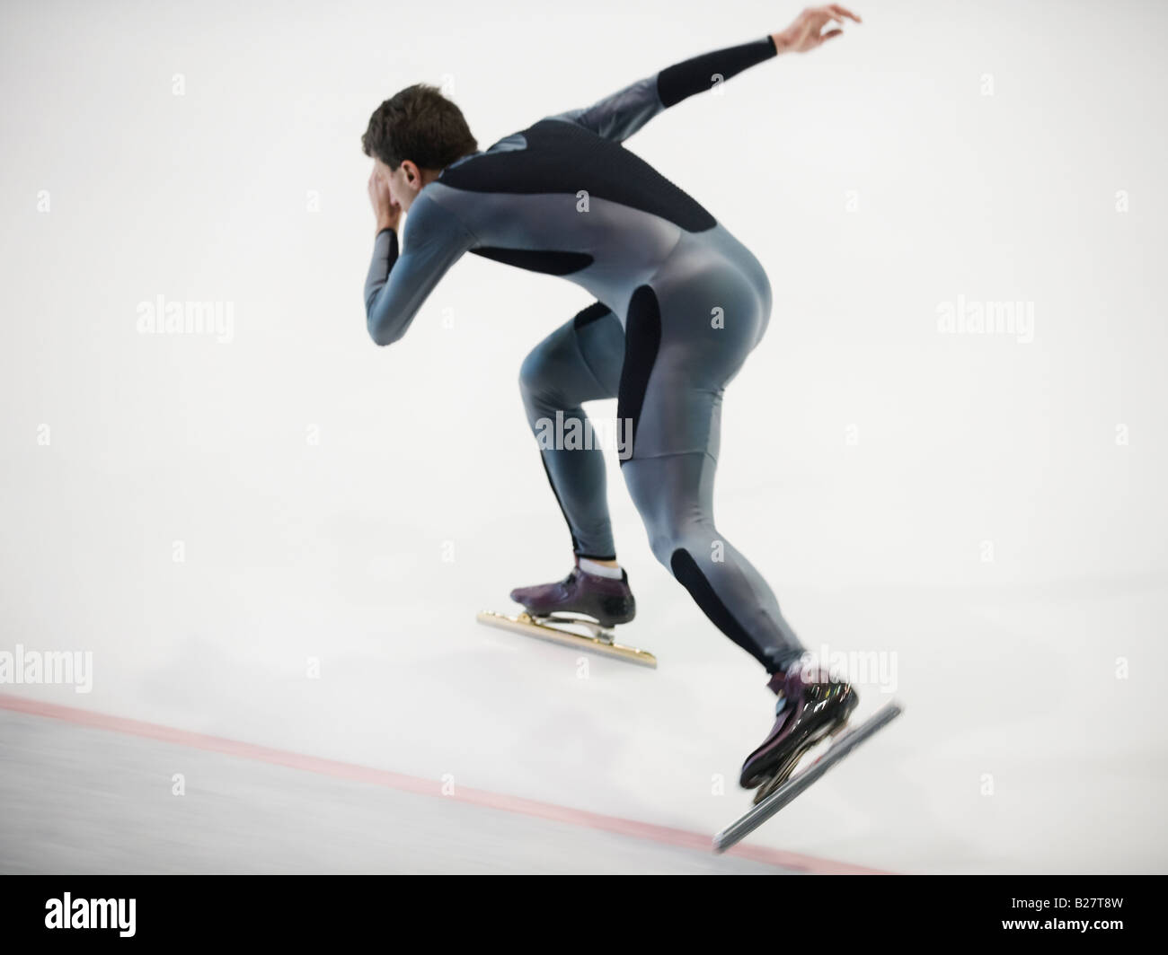 Male speed skater skating Stock Photo - Alamy