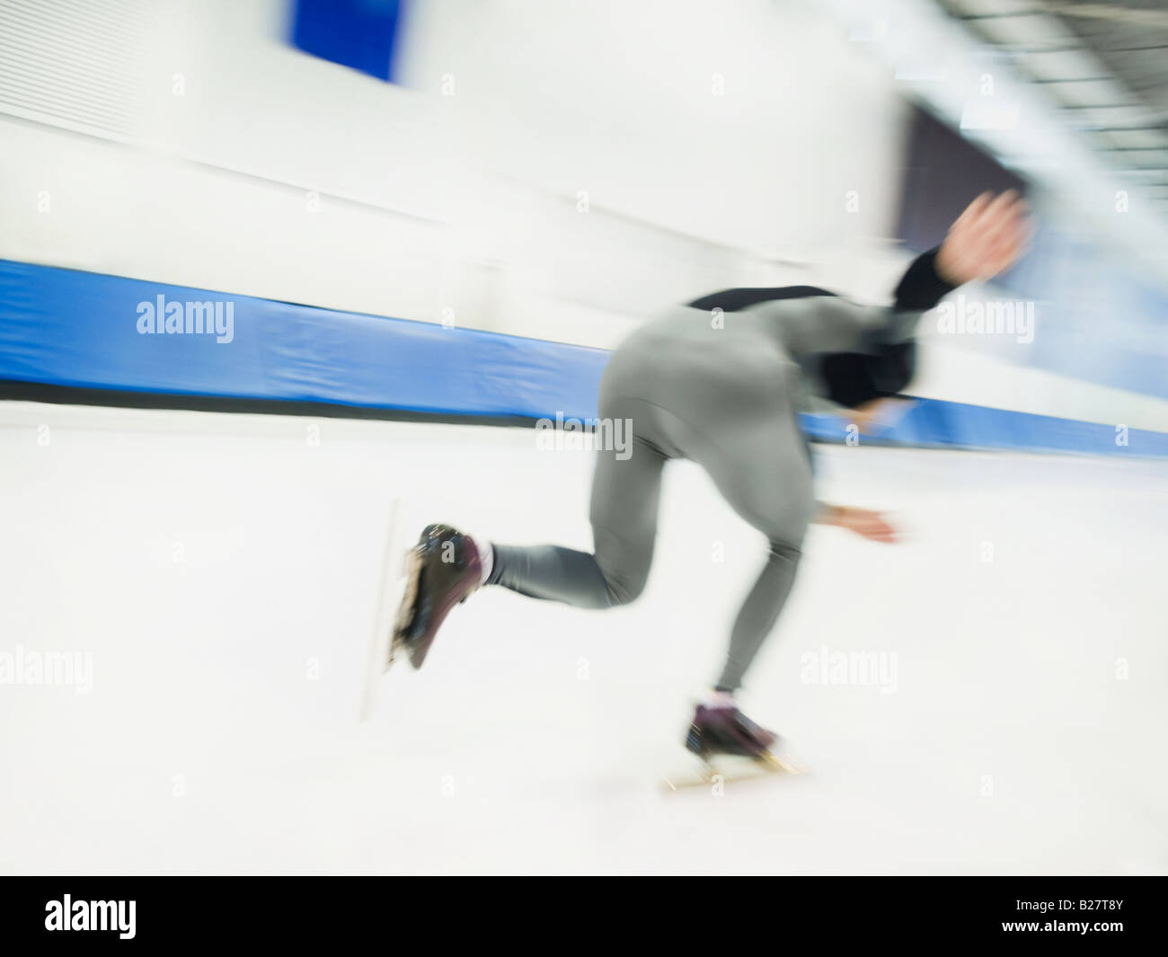 Male speed skater skating Stock Photo - Alamy