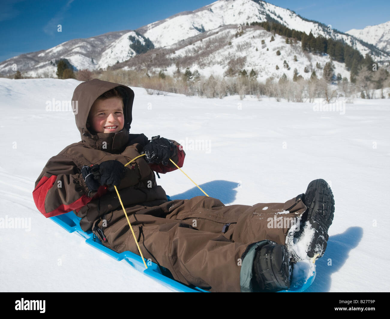 Person on sled hi-res stock photography and images - Alamy