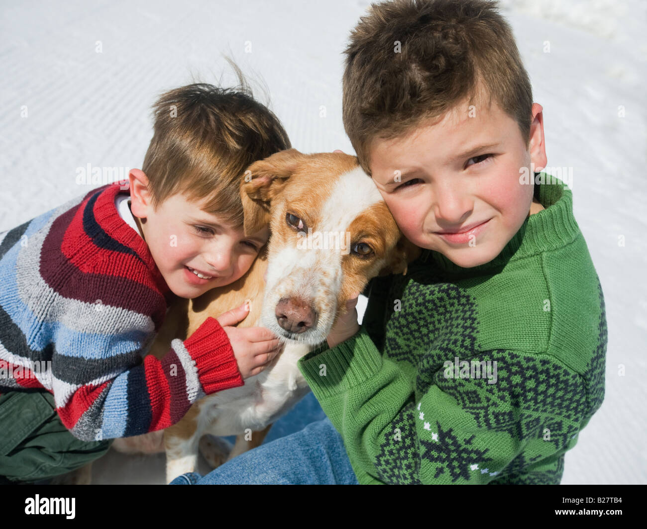 Brothers hugging dog Stock Photo - Alamy