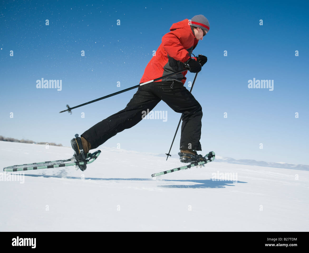 Man jumping in the snow hi-res stock photography and images - Alamy