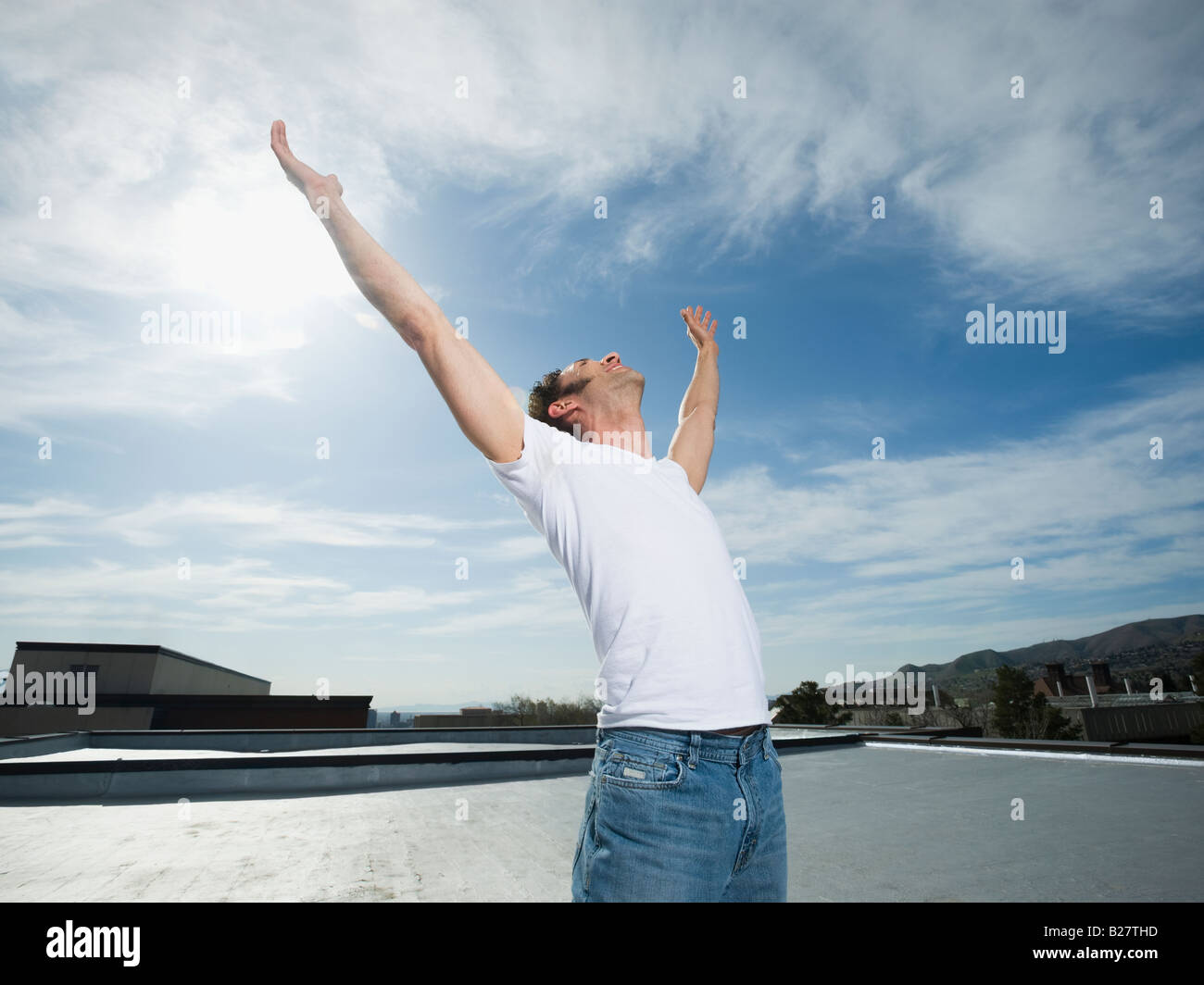 Man with arms raised Stock Photo - Alamy