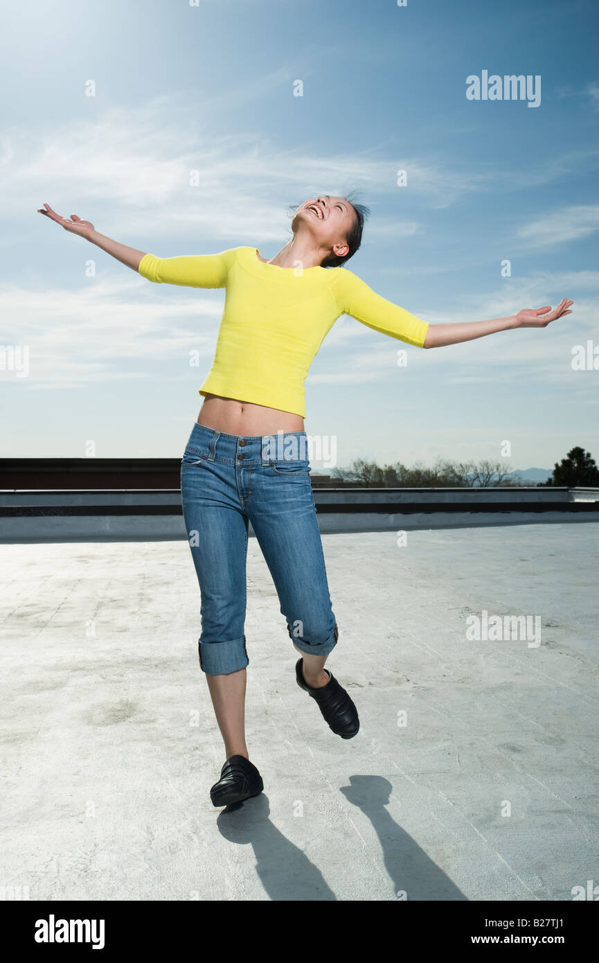 Woman with arm outstretched Stock Photo - Alamy