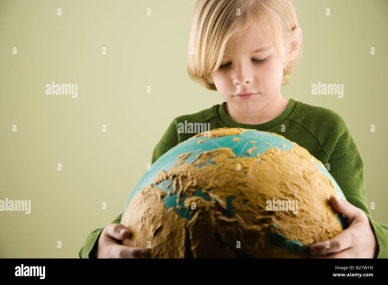 Boy hugging globe hi-res stock photography and images - Alamy