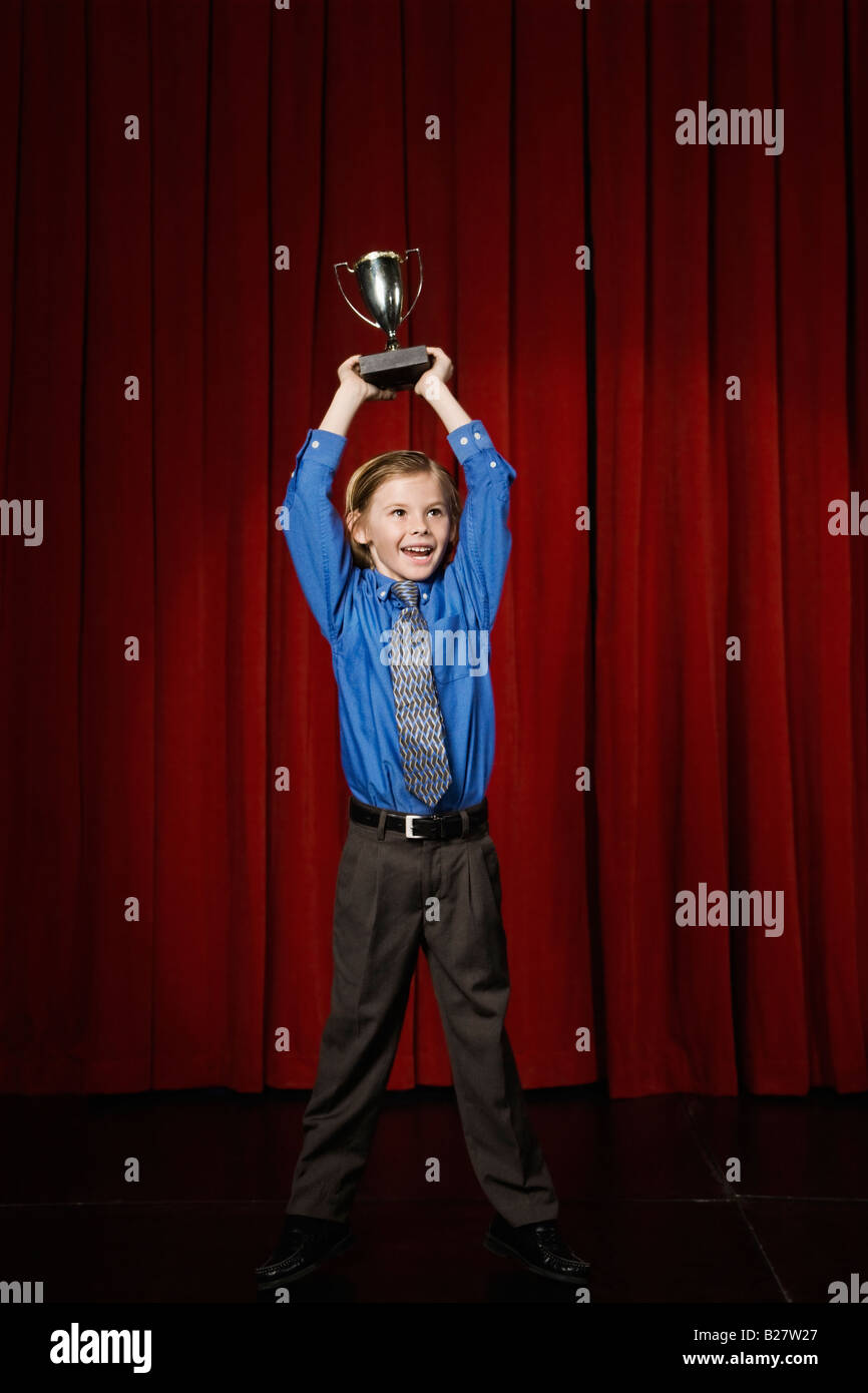 Boy holding trophy stage hi-res stock photography and images - Alamy