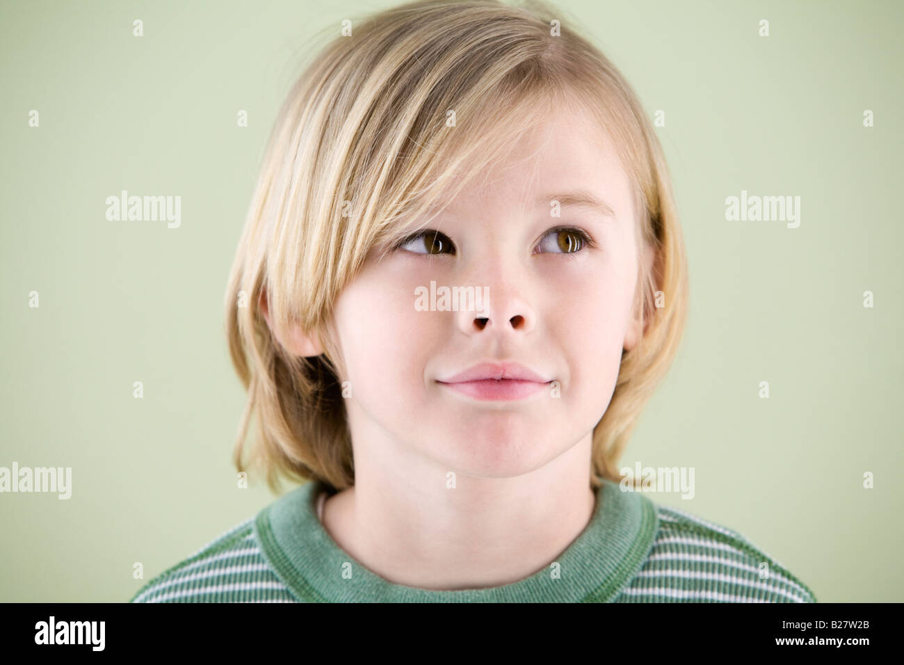 Boy looking sideways Stock Photo - Alamy