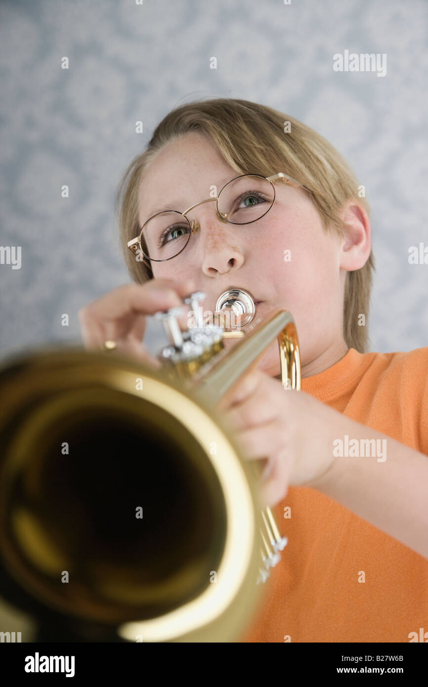 Boy playing trumpet Stock Photo - Alamy