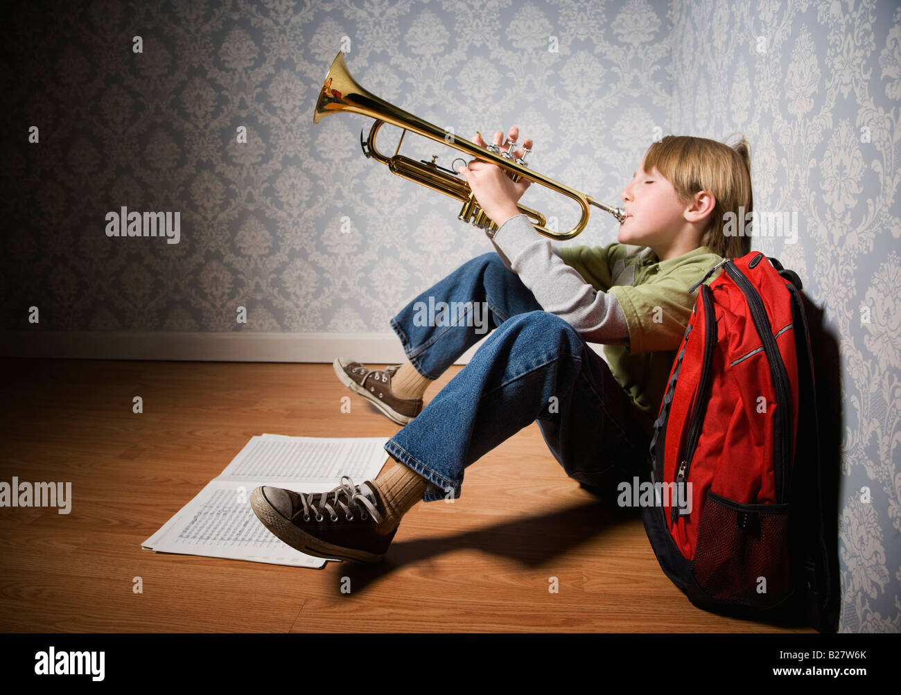 Boy playing trumpet Stock Photo - Alamy