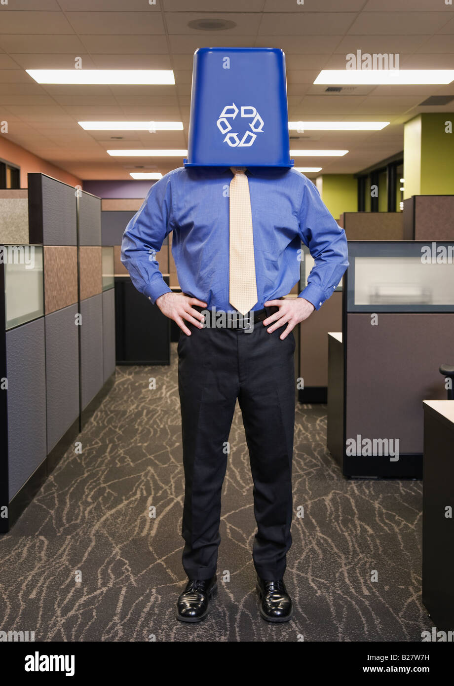 Businessman with recycling bin on head Stock Photo - Alamy