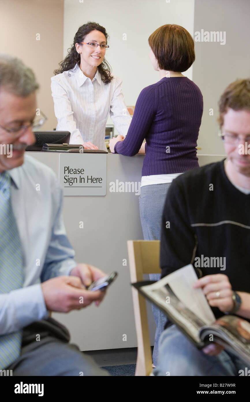 Receptionist talking male patient hi-res stock photography and images ...