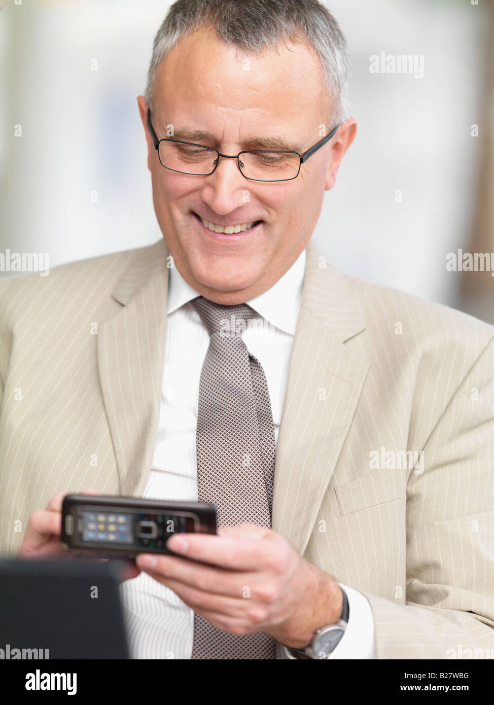 Businessman outdoors looking cell hi-res stock photography and images ...