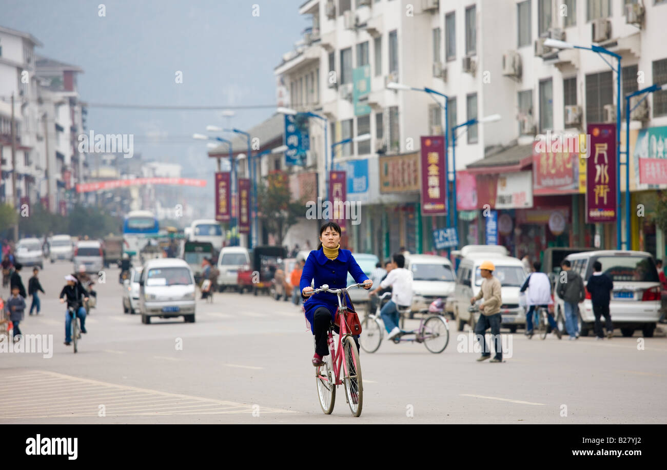 Chinese woman riding a bicycle hi-res stock photography and images - Alamy