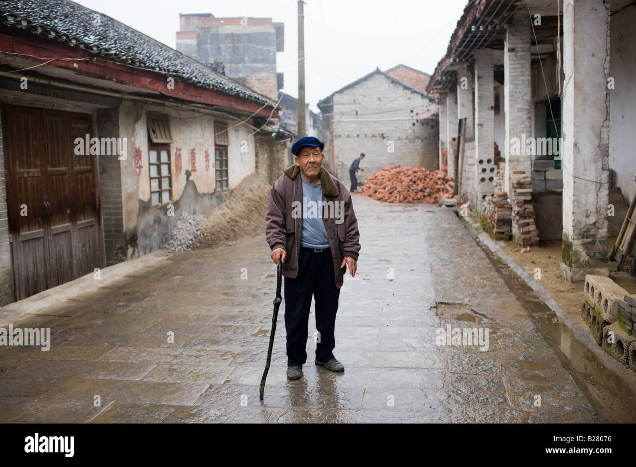 Old chinese man walking stick hi-res stock photography and images - Alamy