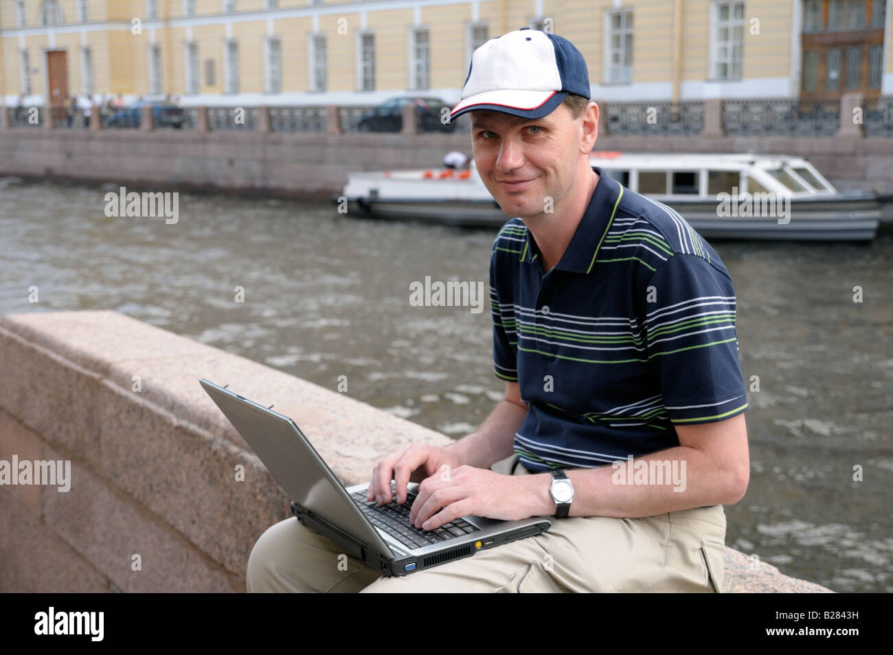 Man with laptop outdoor Stock Photo - Alamy