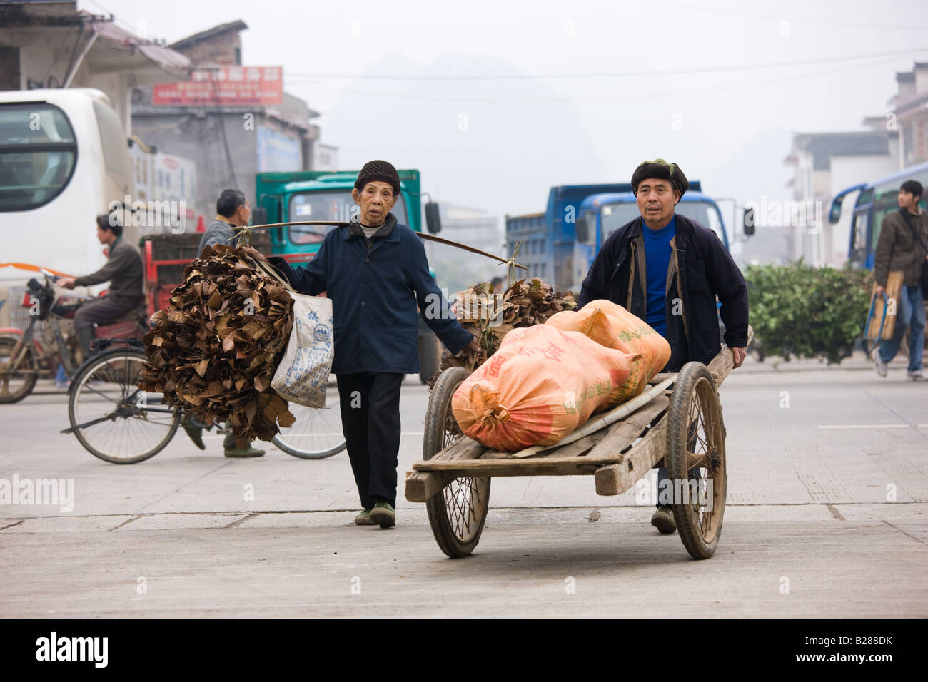 People carry goods to market in Baisha near Guilin China Stock Photo ...