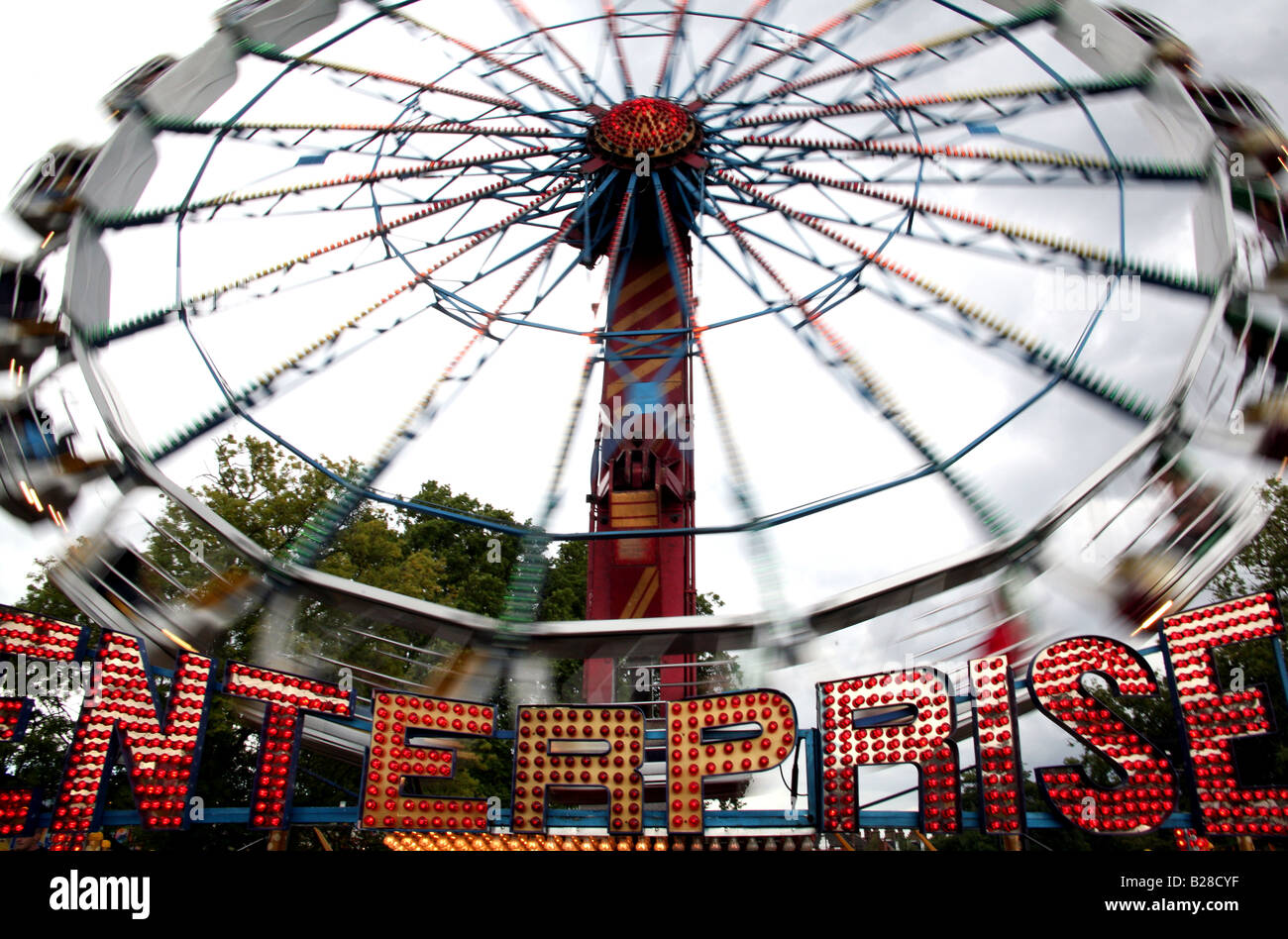 Spinning funfair ride in London park Stock Photo - Alamy