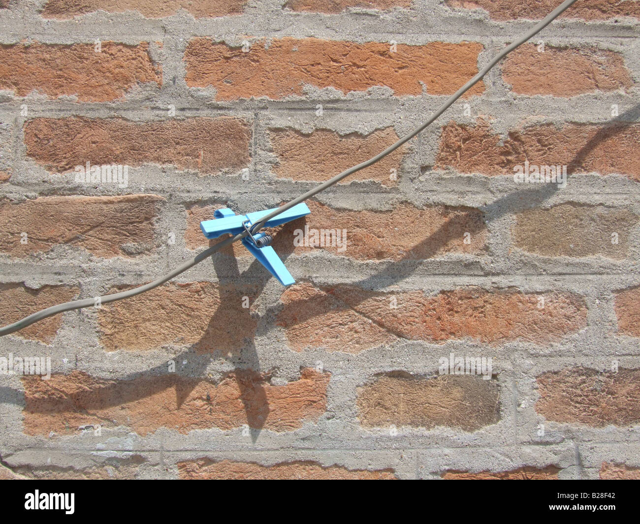 one single peg on clothes line Stock Photo - Alamy
