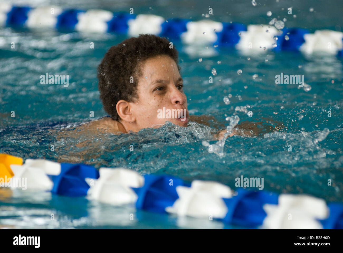 Woman competing in a Special Olympics swimming competition Stock Photo ...
