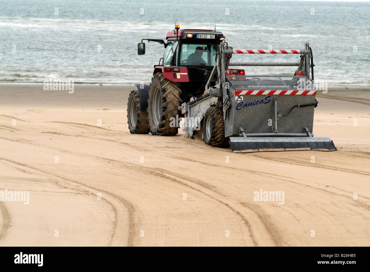 Seaside beach cleaning machine tractor pulled seen here in action in ...