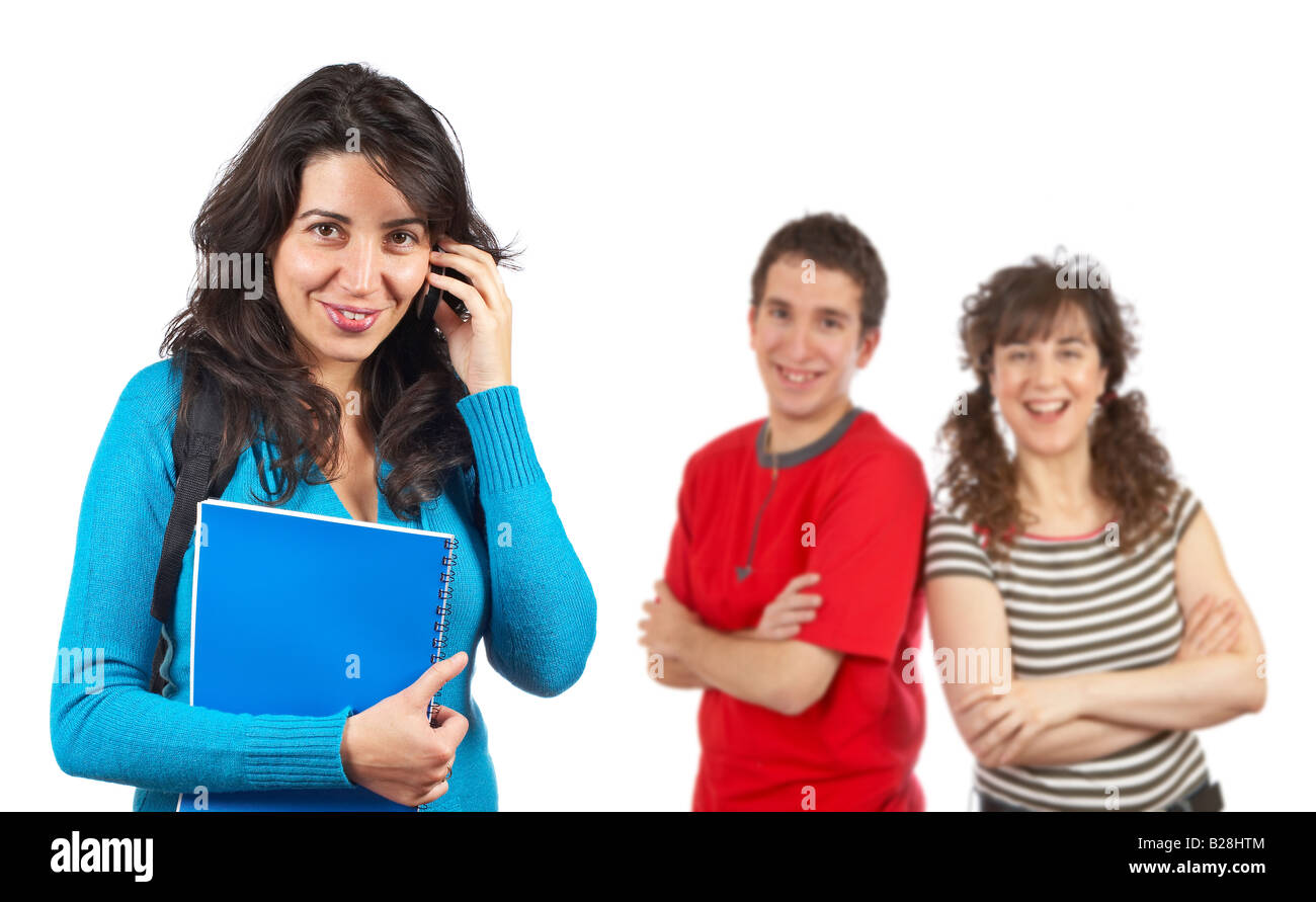 Three students with books and backpacks over a white background Focus ...